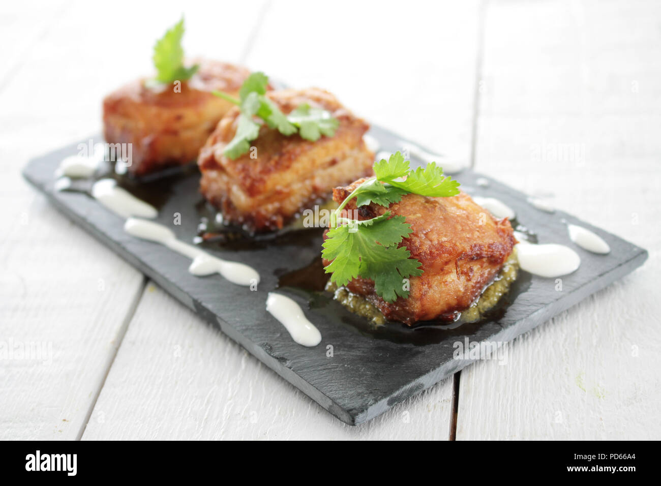 pork belly canape bites Stock Photo - Alamy