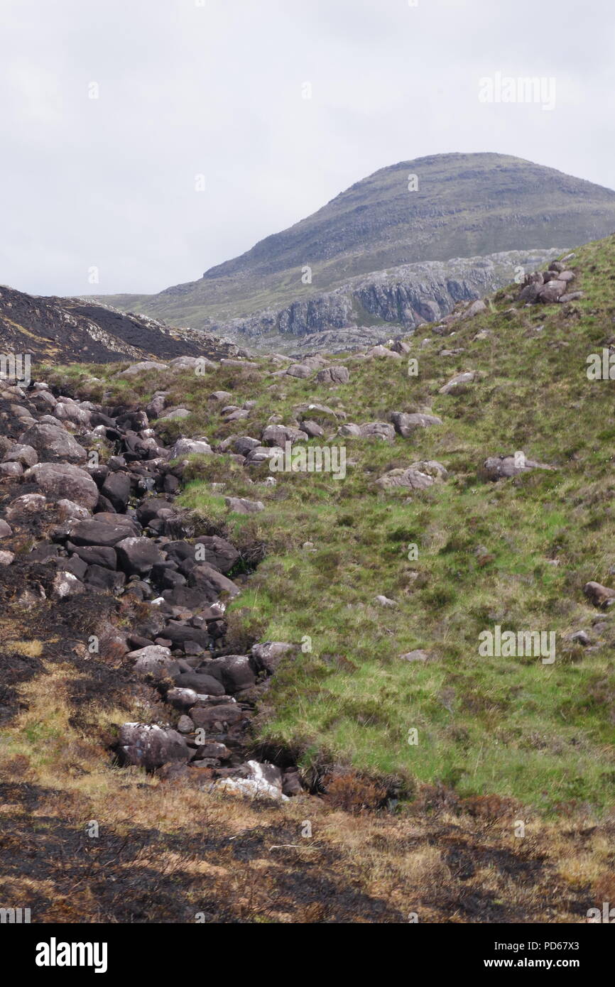 An Ruadh-mheallan Peak of Torridonian Sandstone under Cumulus clouds ...