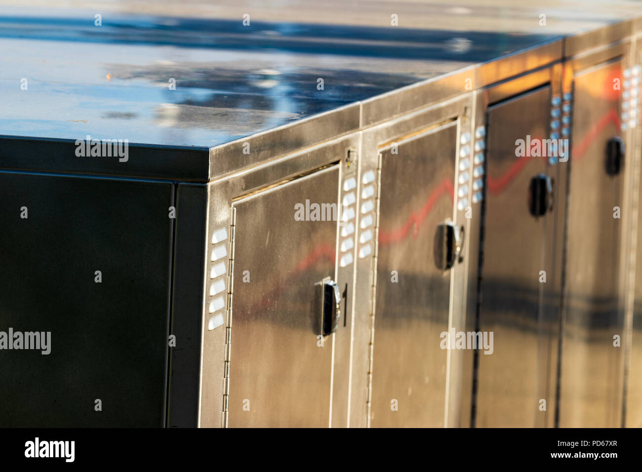 Bright shiny aluminum bicycle lockers close up with reflection Stock ...