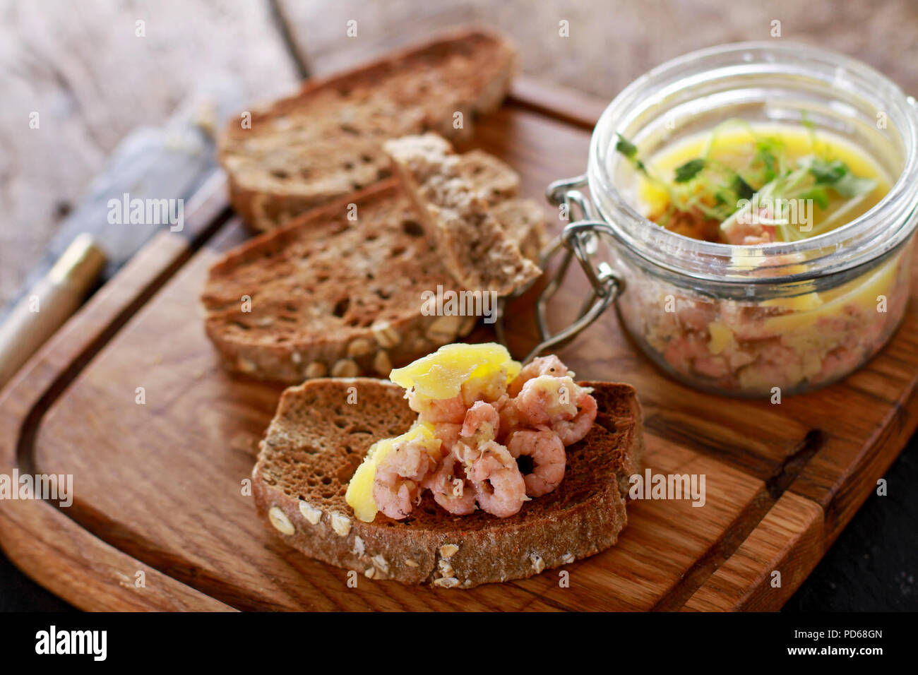 traditional potted shrimp appetizer served with toasted brown bread ...