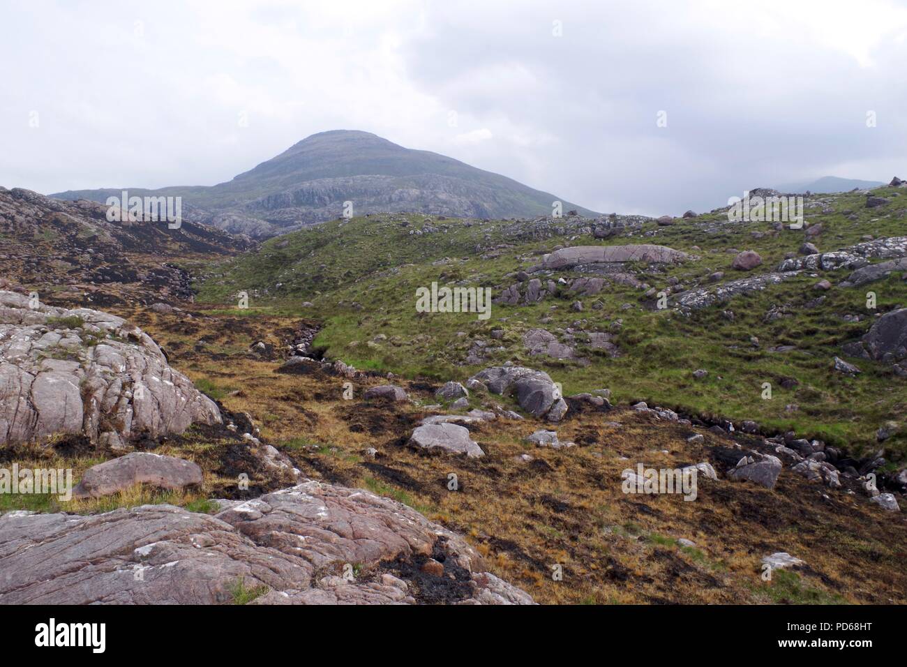 An Ruadh-mheallan Peak Dominating the Rugged Highland Landscape. Burn ...