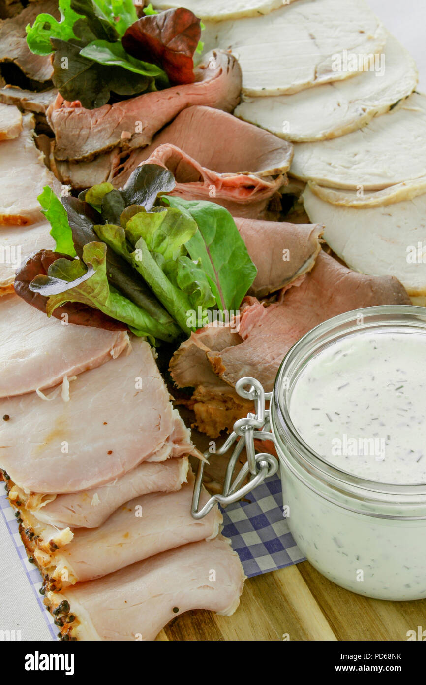fresh sliced cold meat selection buffet table Stock Photo - Alamy