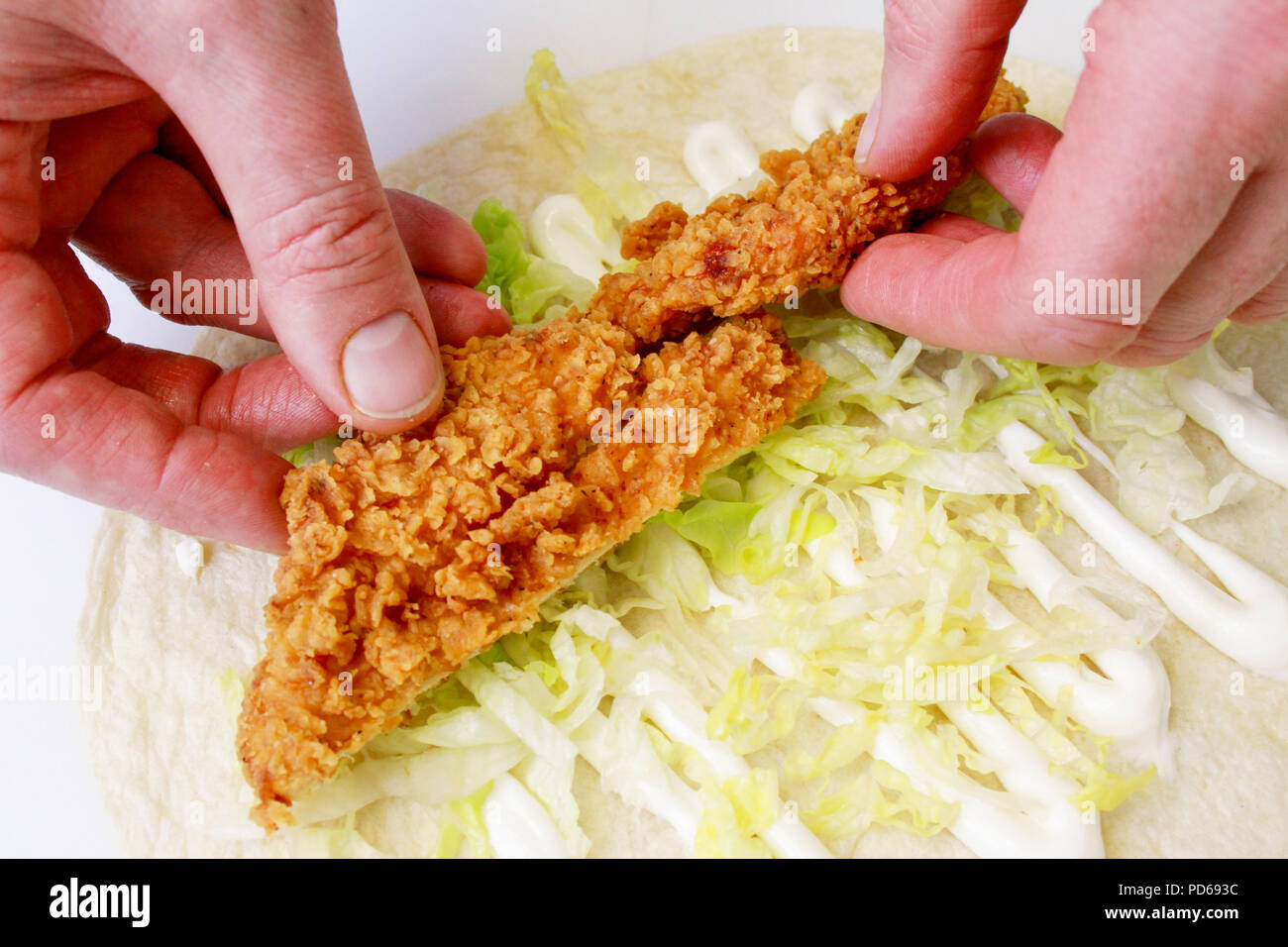 chef preparing chicken wrap Stock Photo - Alamy