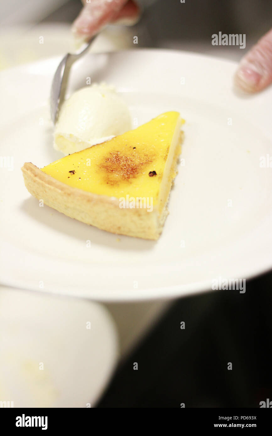chef plating lemon tart dessert Stock Photo - Alamy