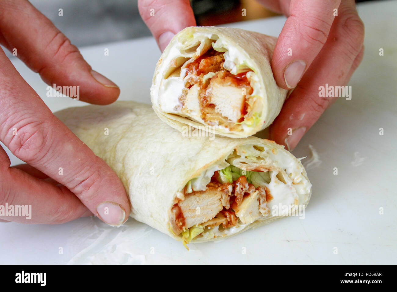 chef preparing chicken wrap Stock Photo - Alamy