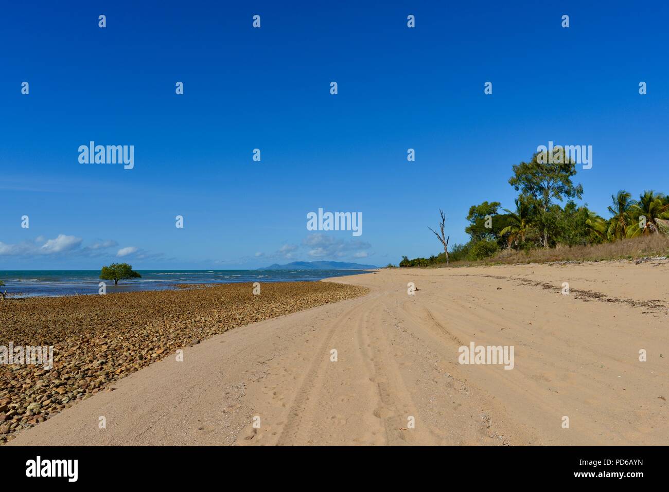 Rocky beach merging with a sandy beach, natural patterns, Coastal ...
