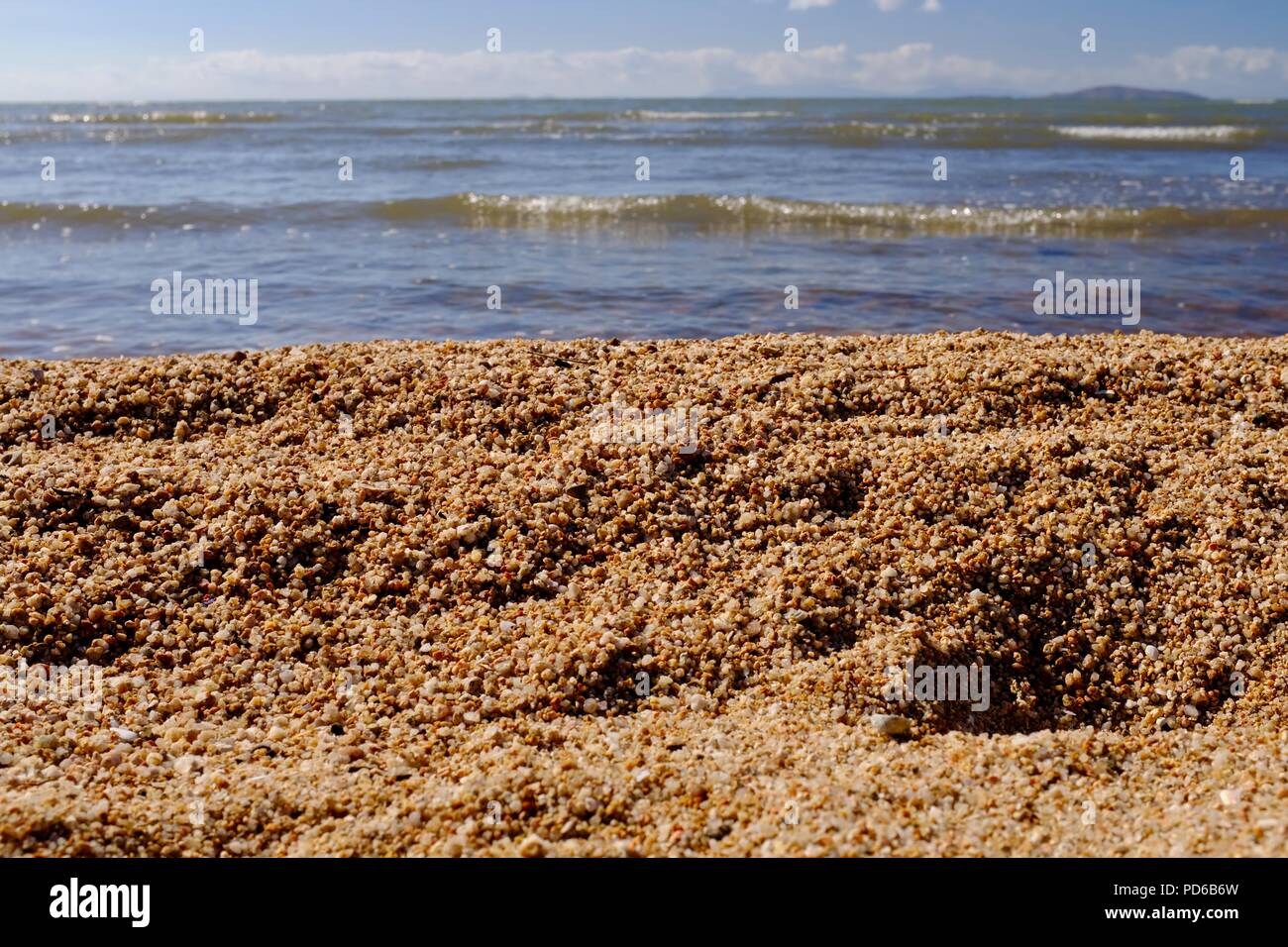 Australian gravel and shell coarse beach sand with waves in hi-res ...