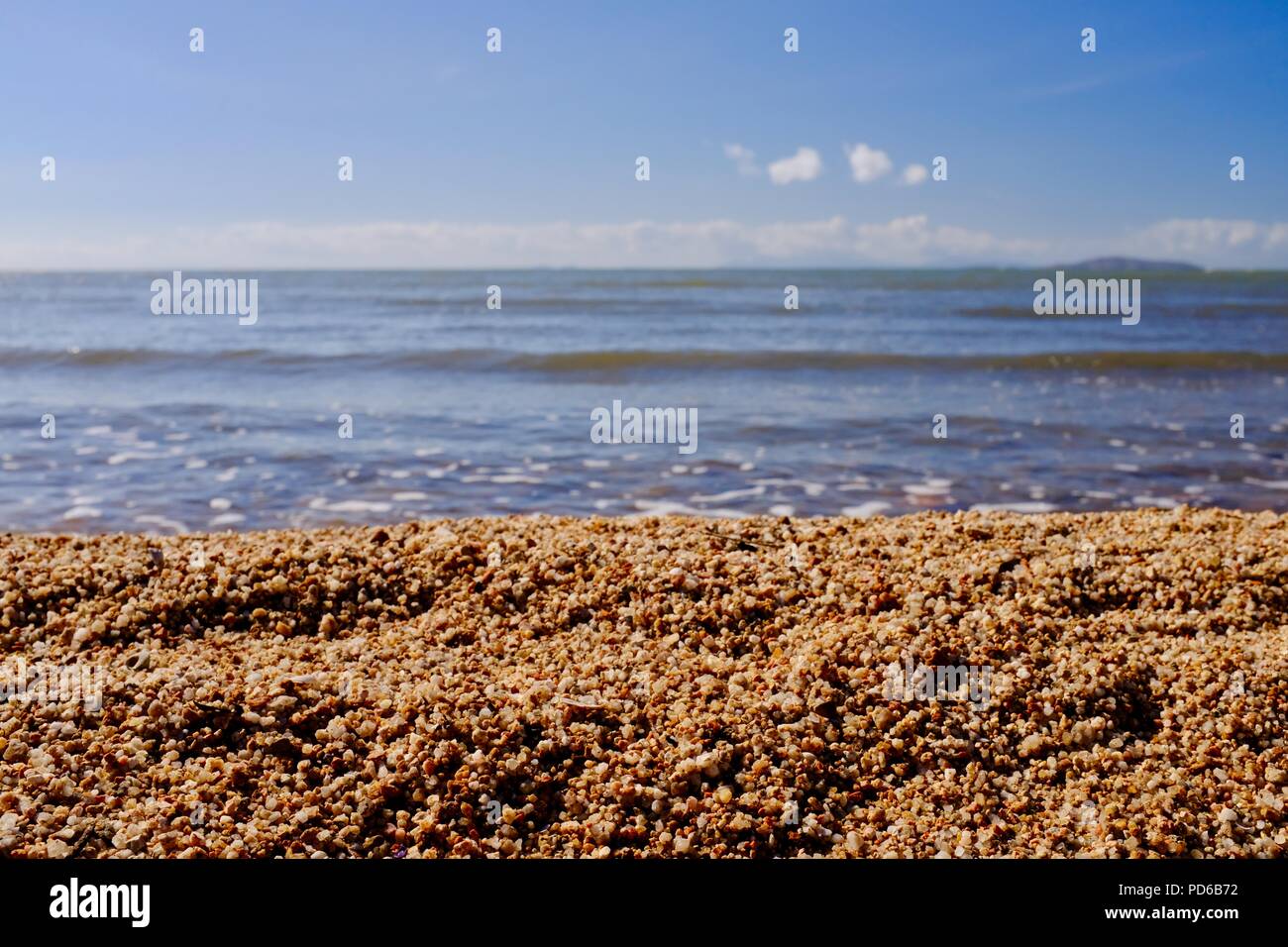 Australian gravel and shell coarse beach sand with waves in hi-res ...