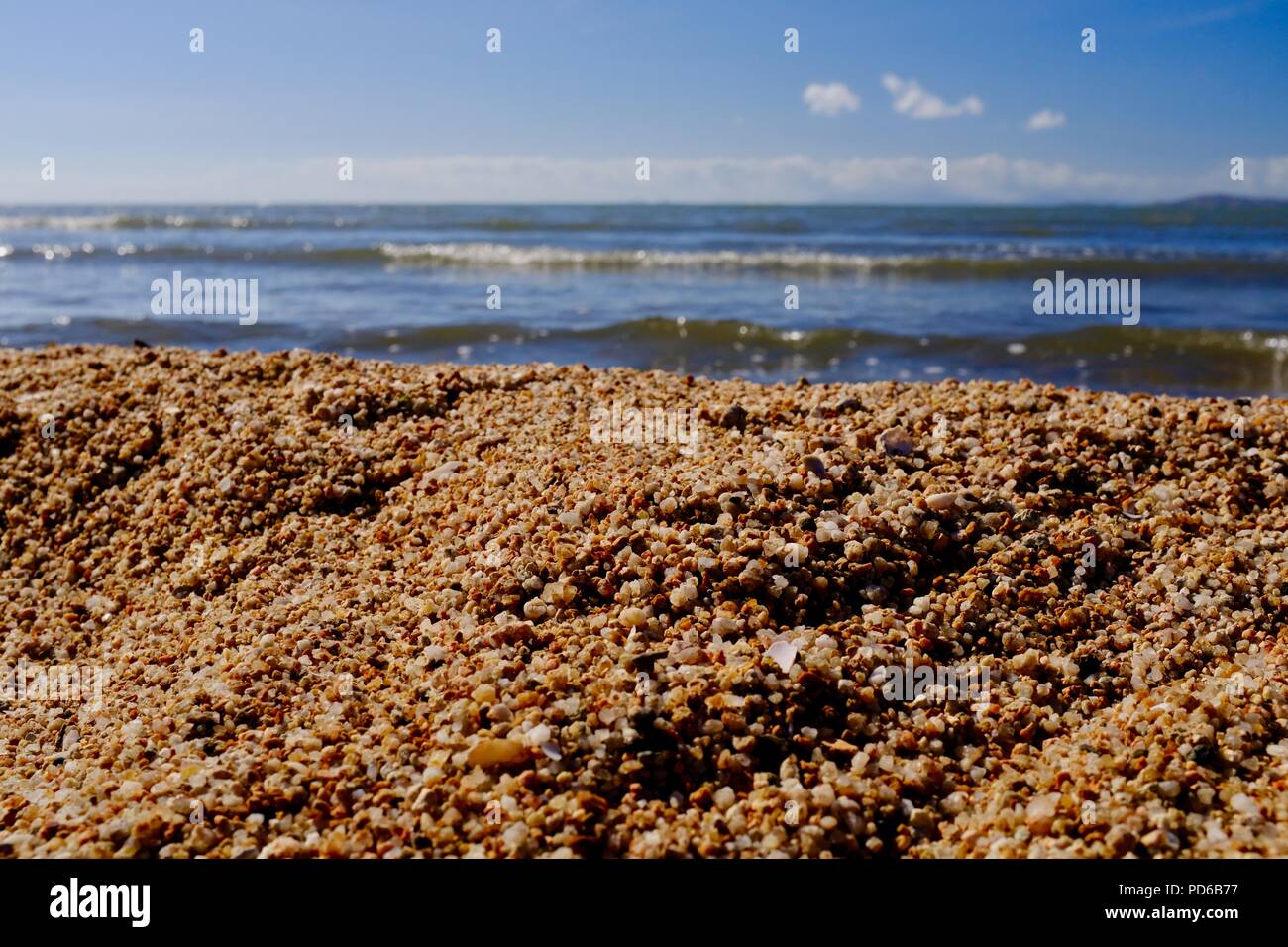 Australian gravel and shell coarse beach sand with waves in hi-res ...