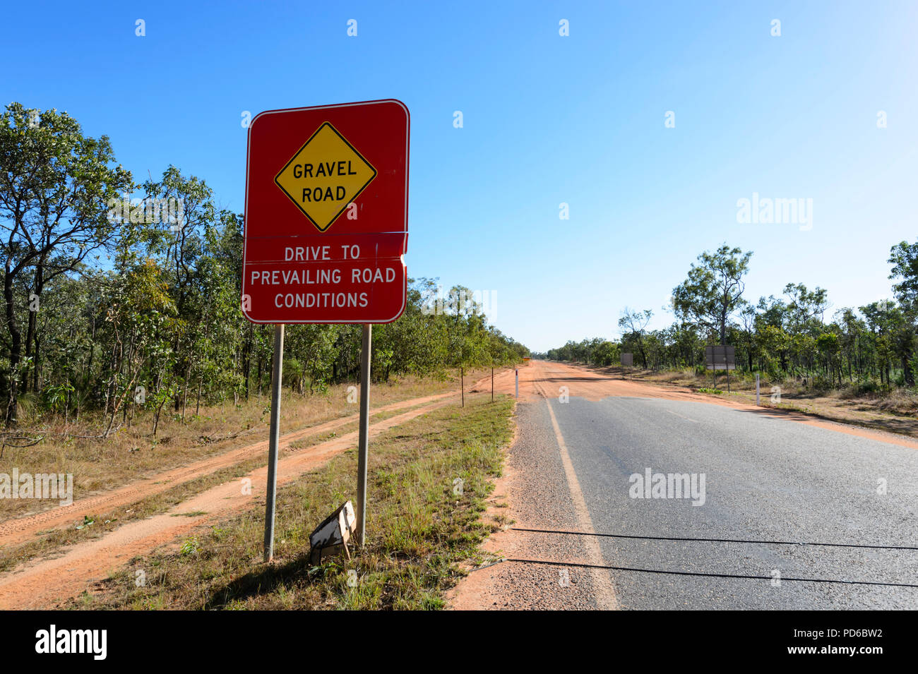 Road sign warning of a gravel road, Peninsula Development Road (PDR ...
