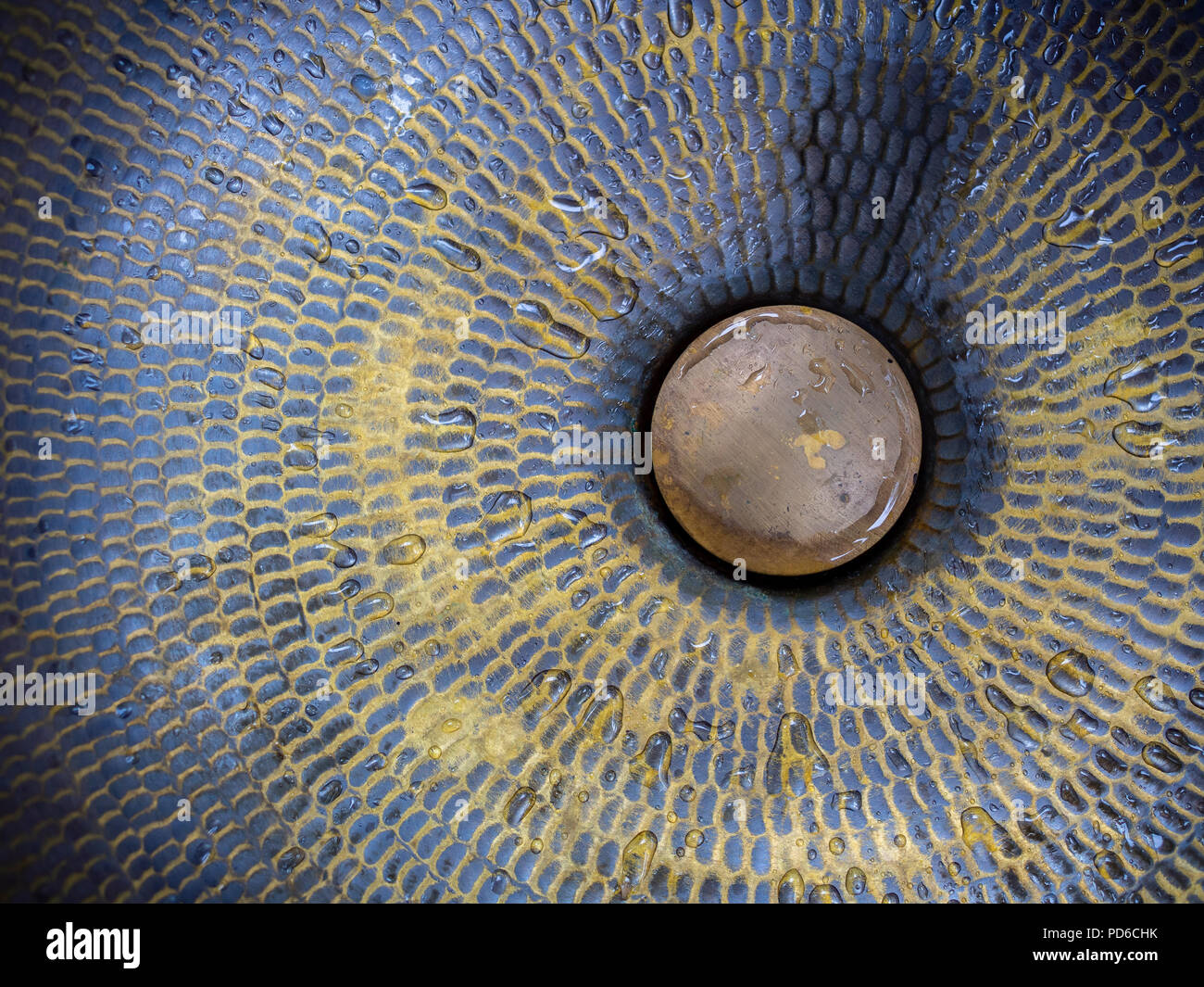 Vintage round brass wash basin texture with water drops background top ...