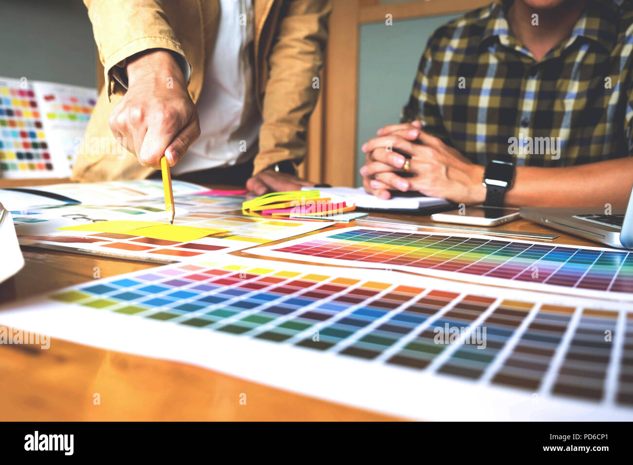 Graphic designers choose colors from the color bands samples for design ...