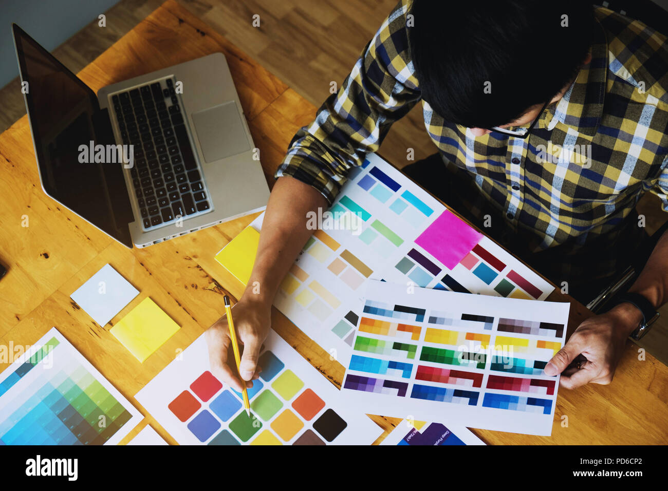 Graphic designers choose colors from the color bands samples for design ...