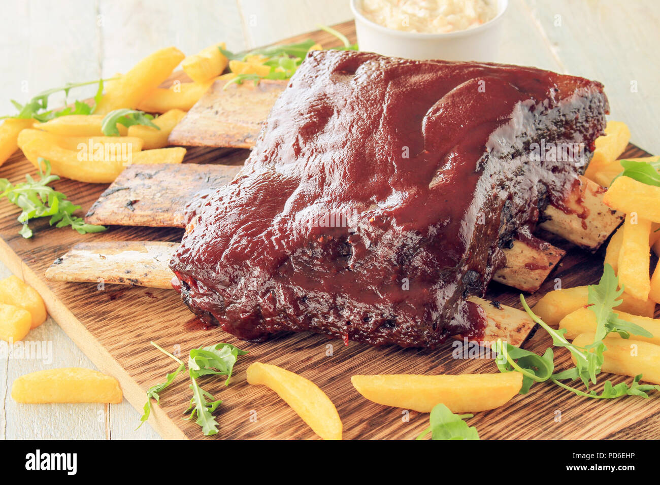 large barbecue roast beef rib with fries Stock Photo - Alamy