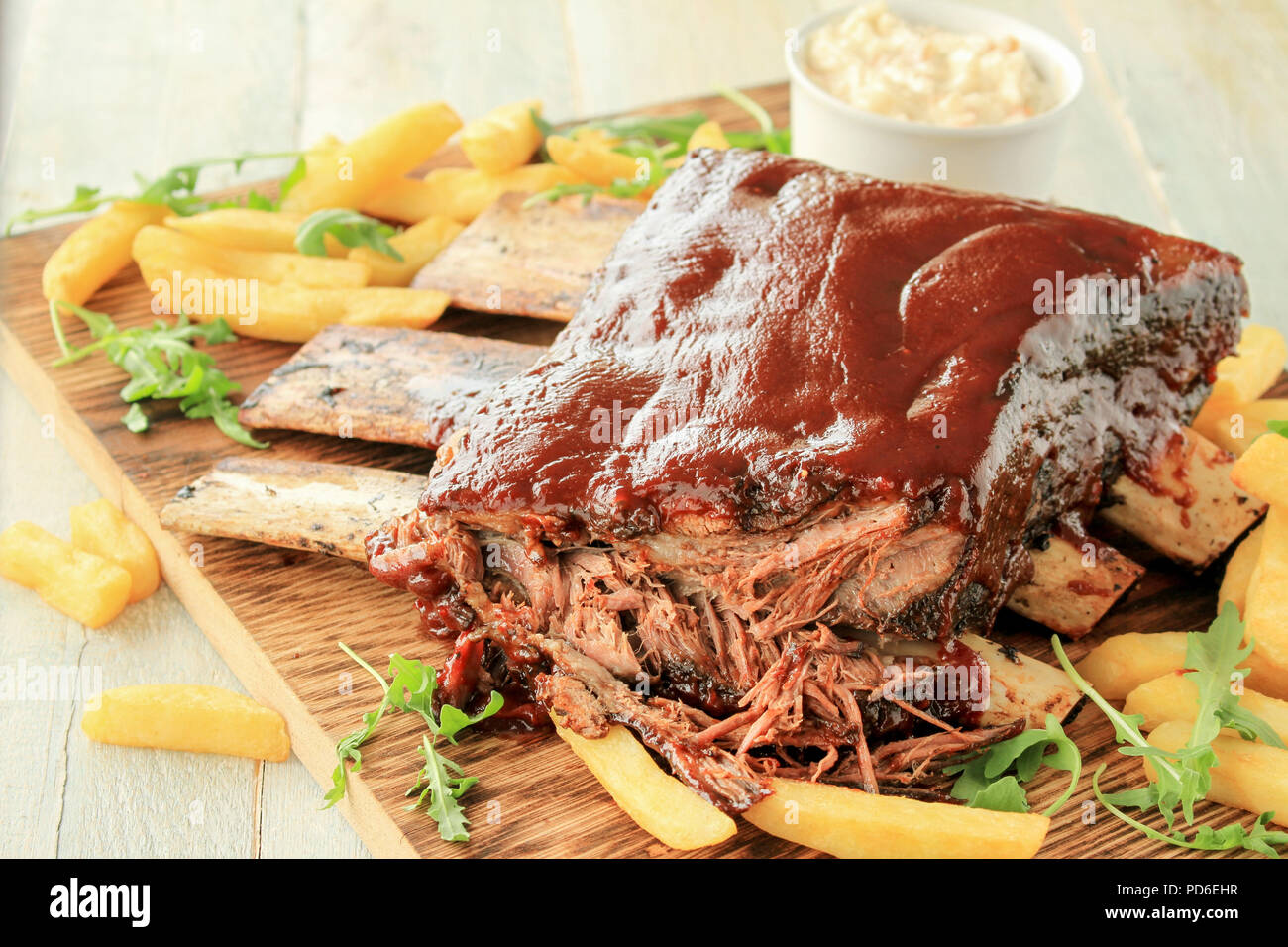 large barbecue roast beef rib with fries Stock Photo - Alamy