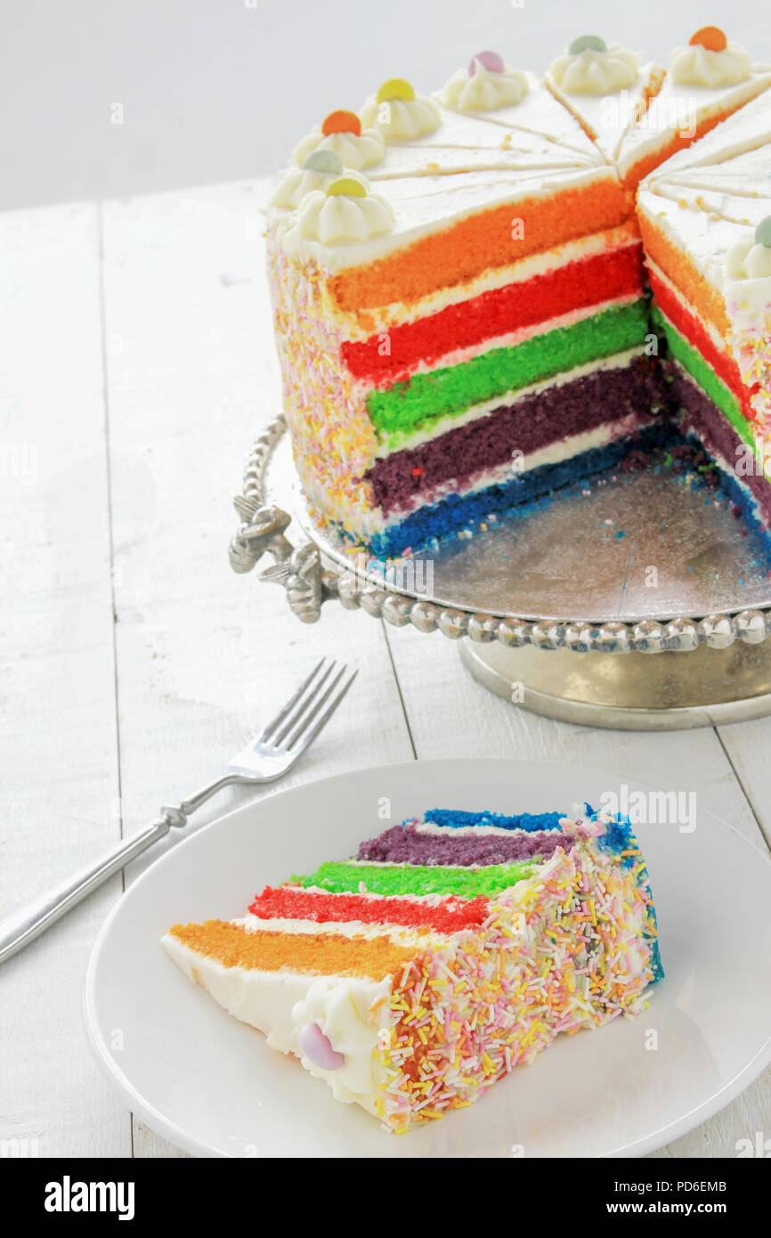 large layered rainbow cake Stock Photo - Alamy