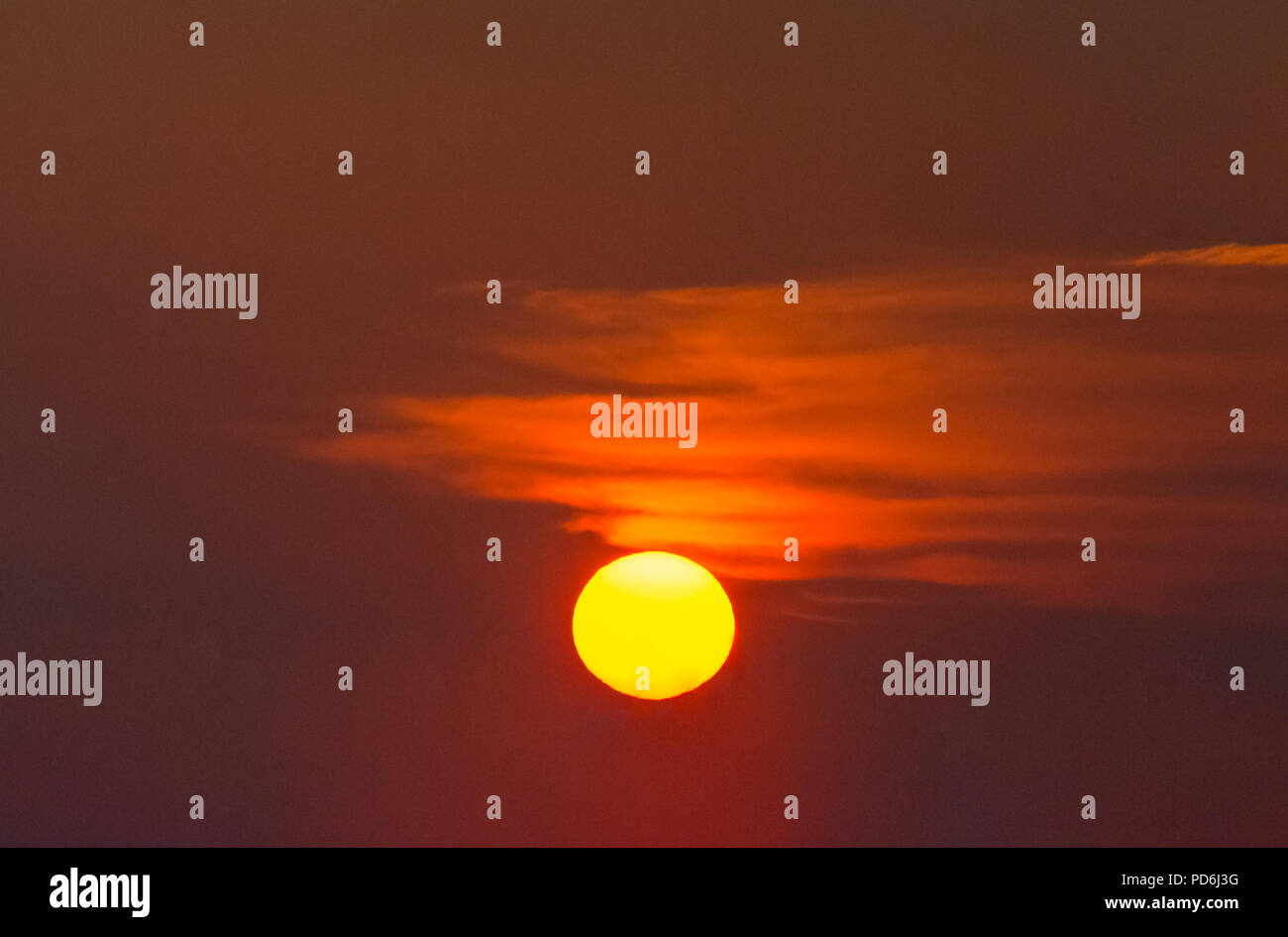 sun in the red sunset sky Stock Photo - Alamy