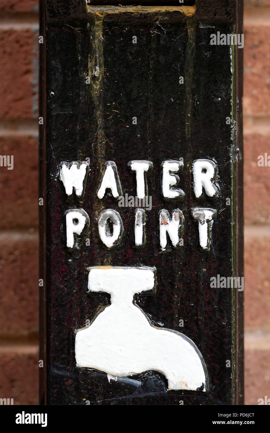 Water Point Sign with white paint text and tap faucet on black ...