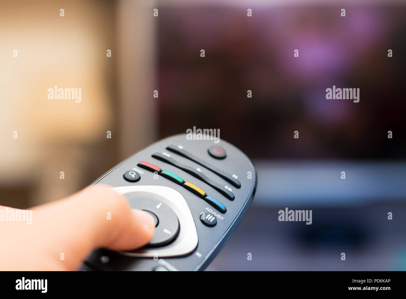 Watching TV and pressing remote controller in first person view Stock ...