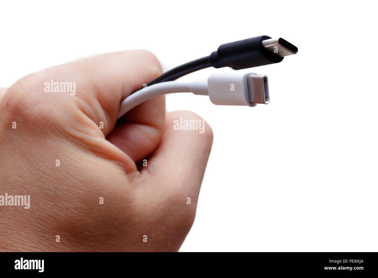 Hand holding black and white Usb type-c connector isolated on white ...