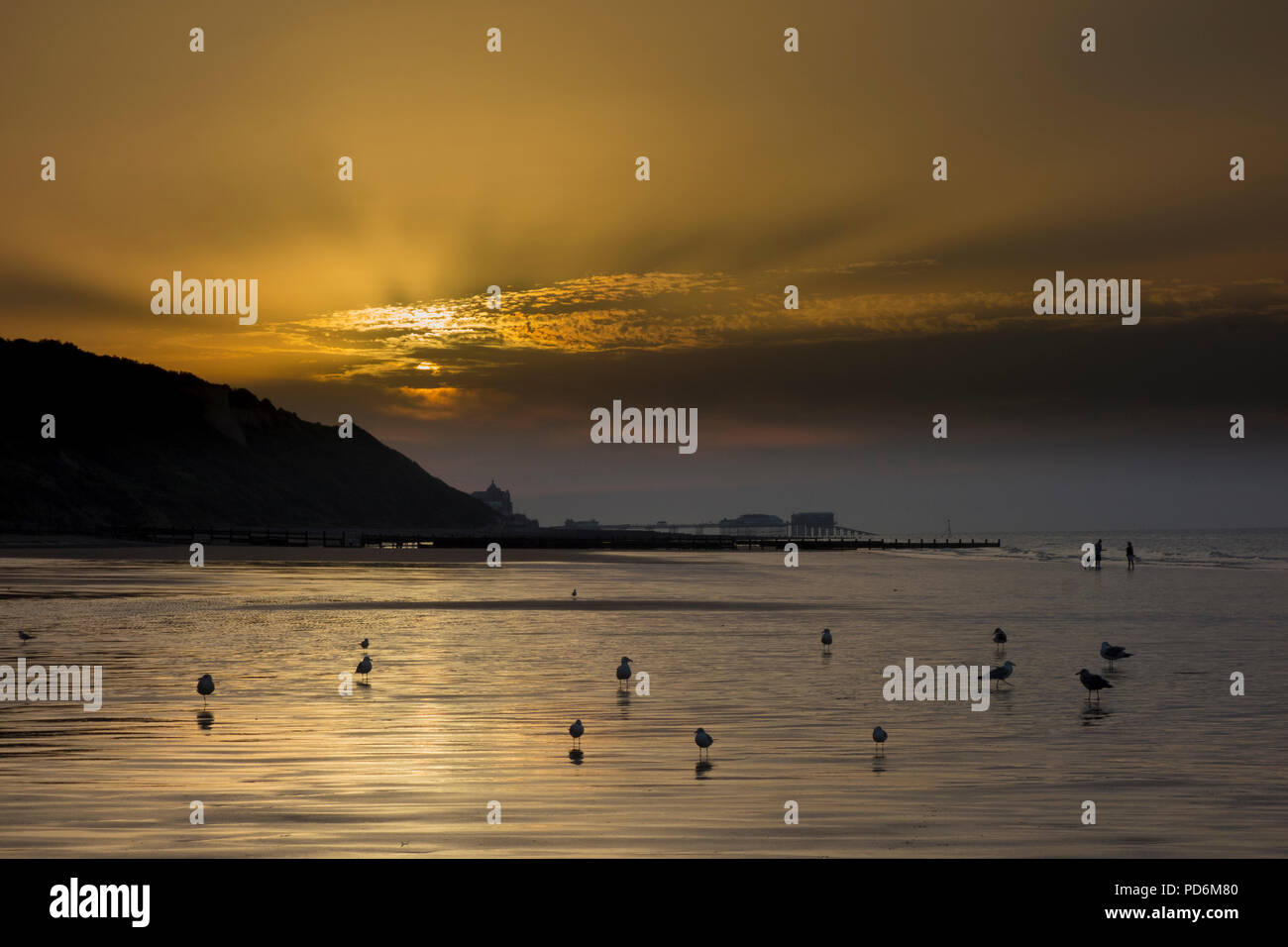 Cromer beach sunset Stock Photo - Alamy