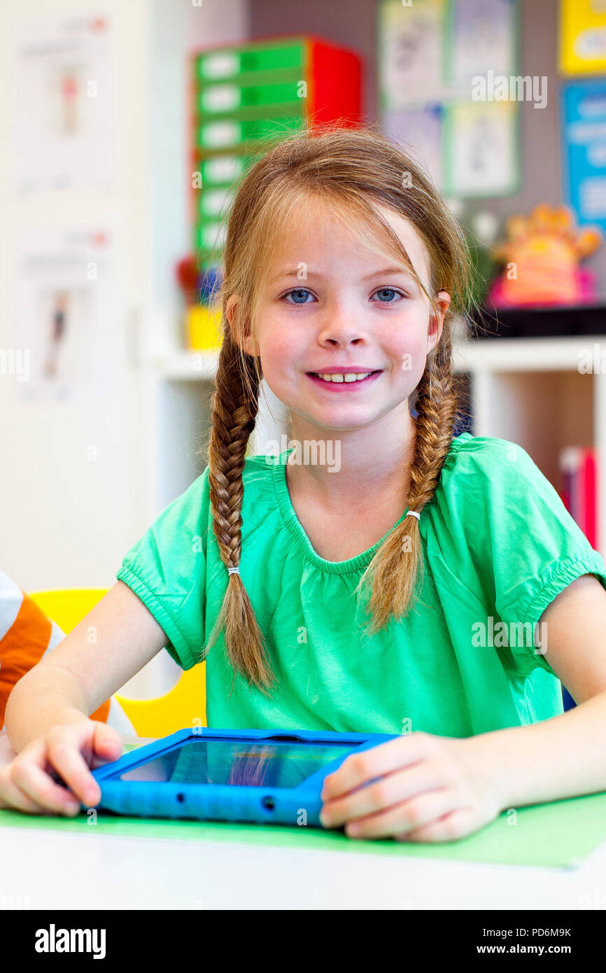 Pupils work with tablet in school Stock Photo - Alamy