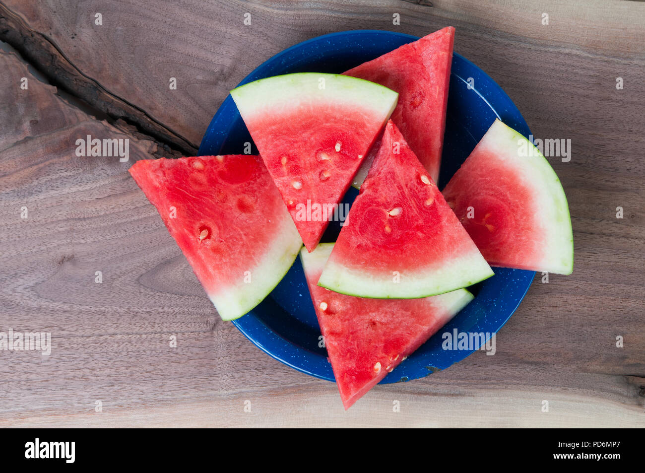 watermelon slices on a blue plate Stock Photo - Alamy