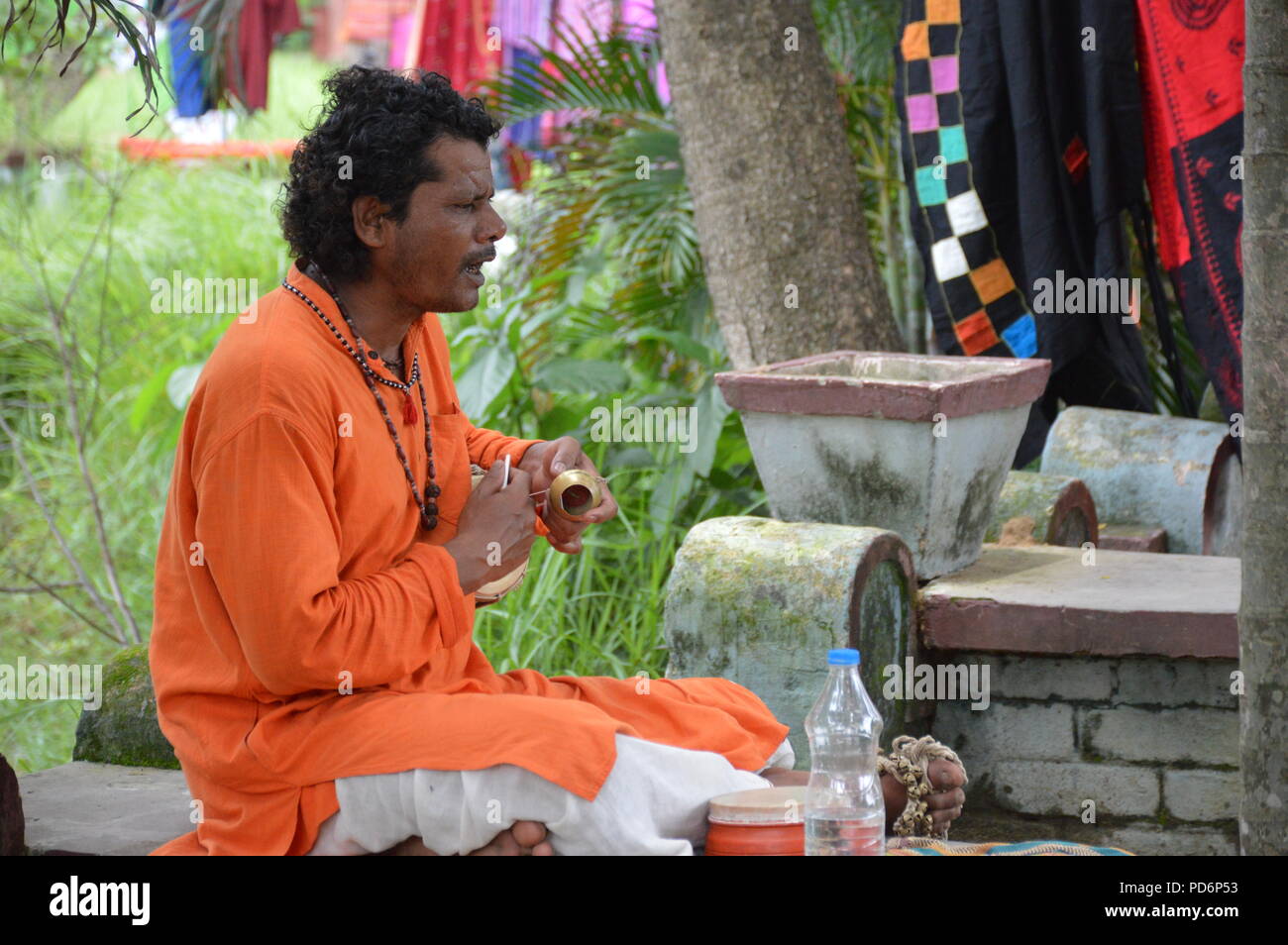 A Baul is performing Baul song at the Srijani Shilpagram compound ...