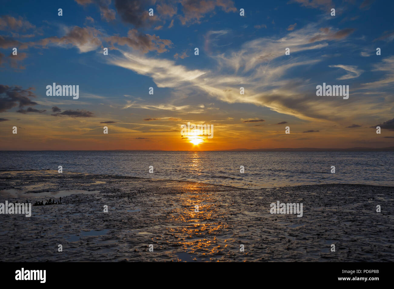 The sun setting Stock Photo - Alamy