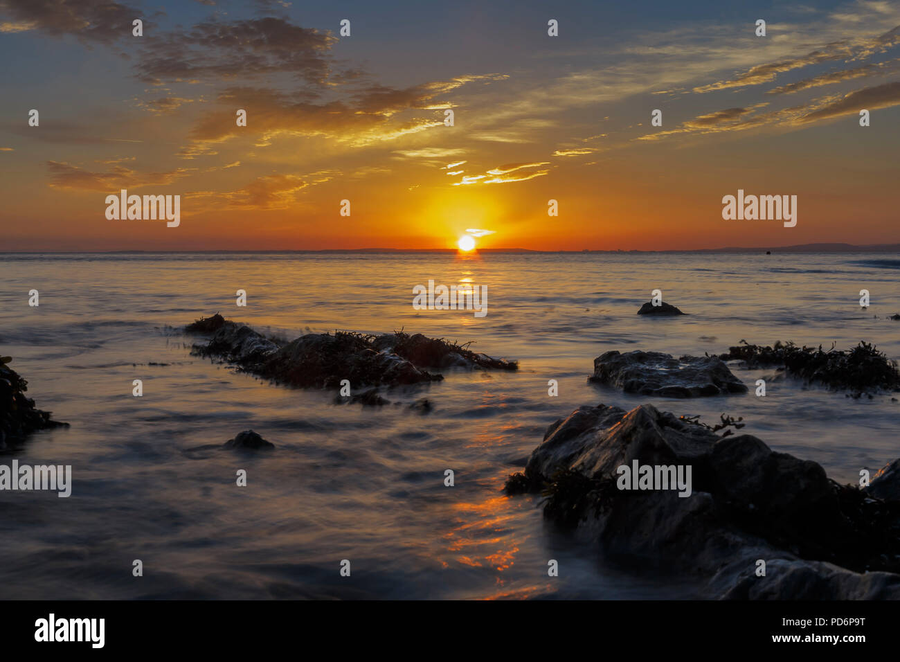 Sea lapping at rocks hi-res stock photography and images - Alamy
