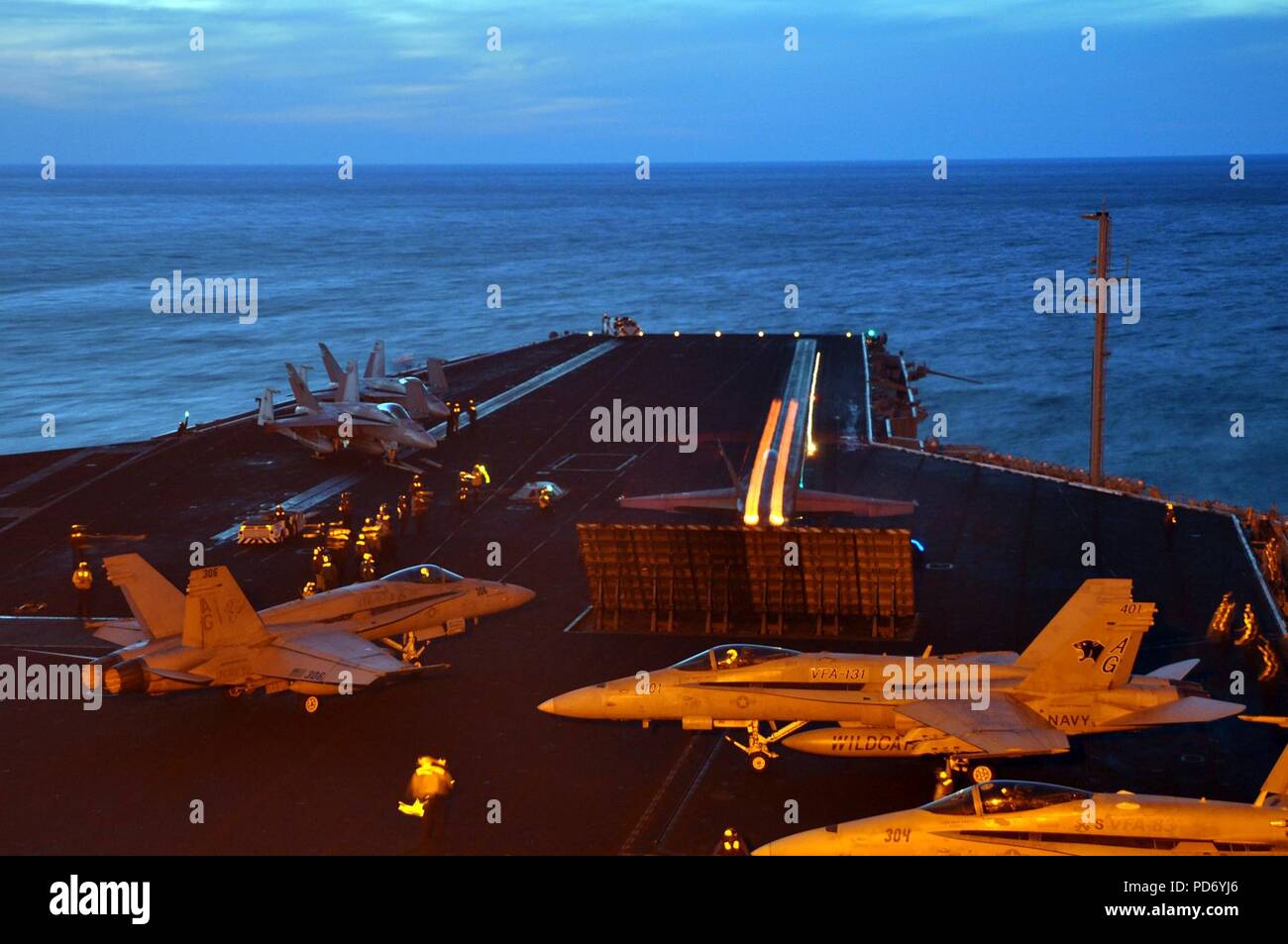 An F-18 Hornet launching from the flight deck of the aircraft carrier ...