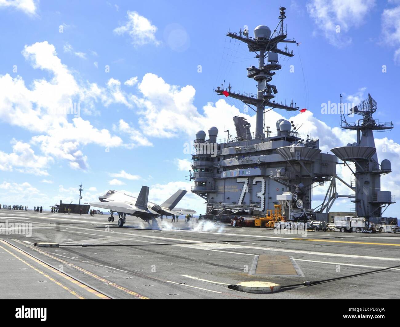 An F-35C Lightning II carrier variant lands on the flight deck of USS ...