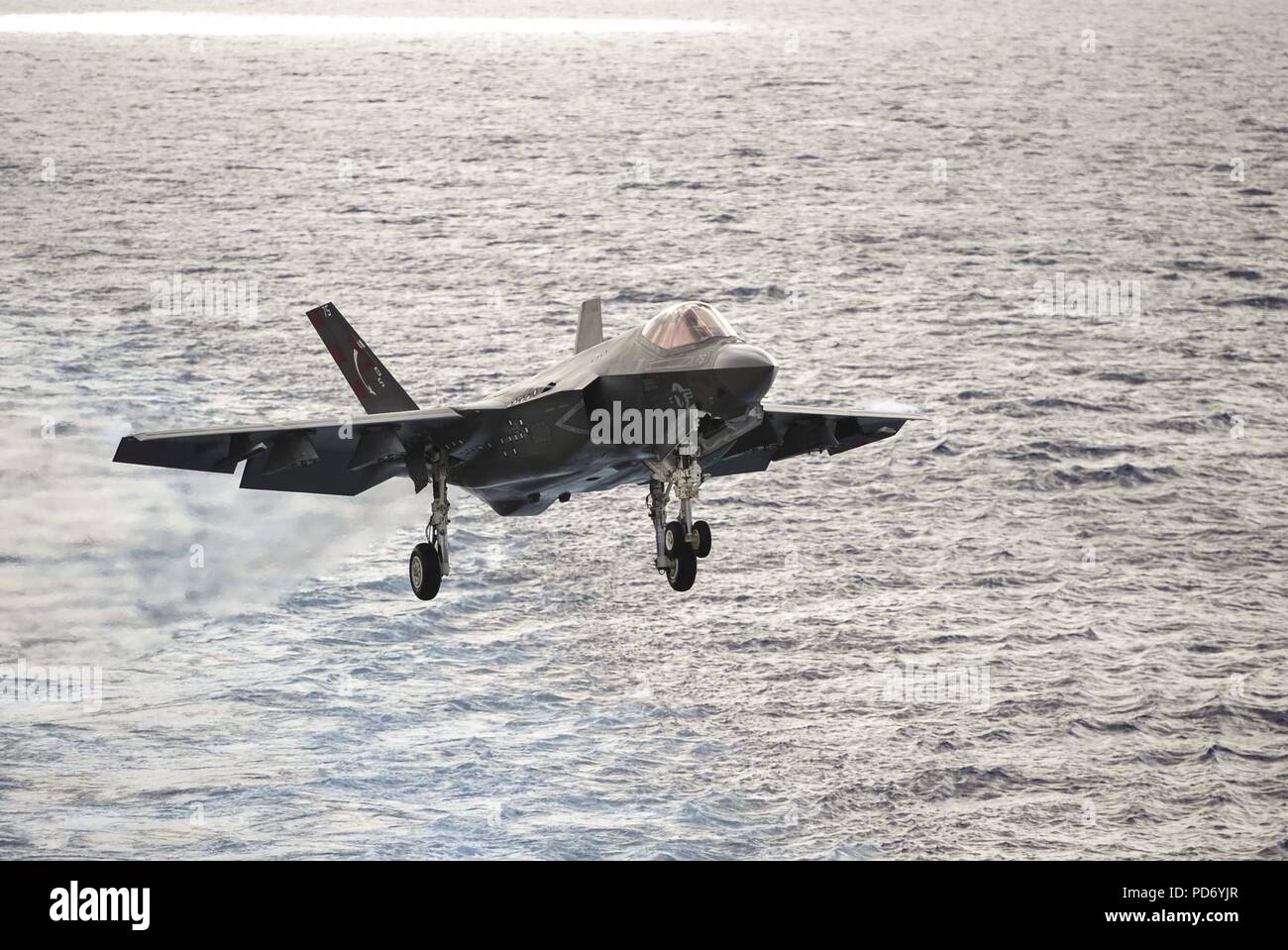 An F-35C prepares to land on the flight deck of USS George Washington ...