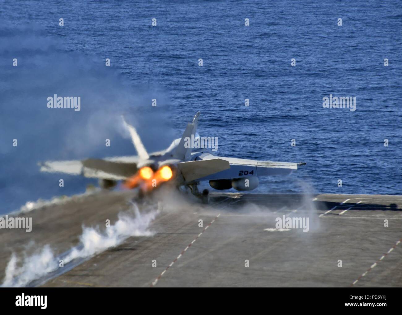An F-A-18E Super Hornet launches from the aircraft carrier USS Nimitz ...