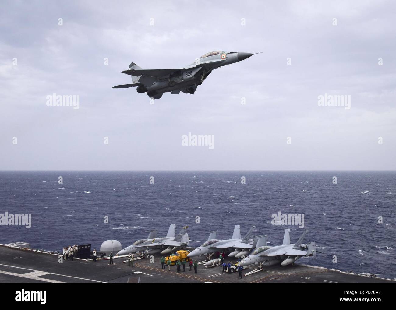 An Indian navy MIG-29K Fulcrum aircraft flies over USS Nimitz during ...