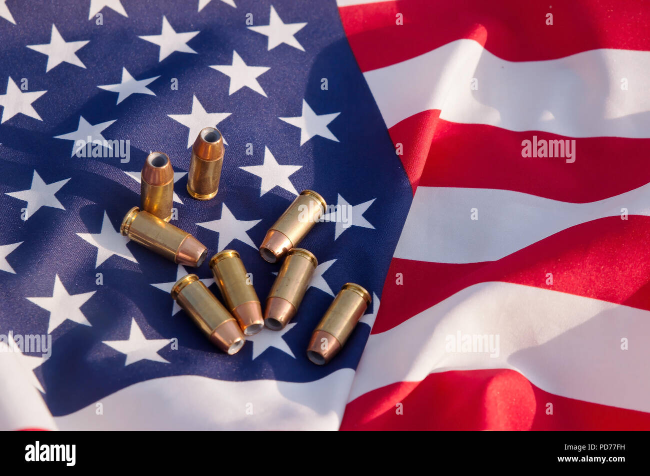 40 caliber hollow point bullets shown with an American flag background ...