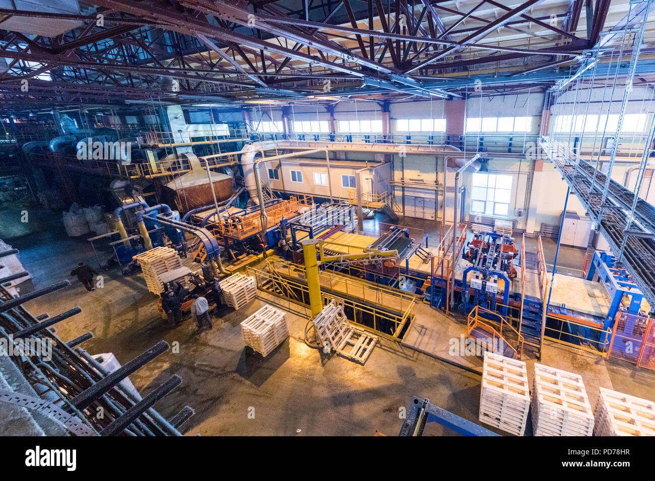 Fiberglass production industry equipment at manufacture background ...