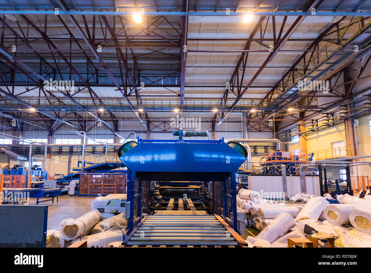 Fiberglass production industry equipment at manufacture background ...