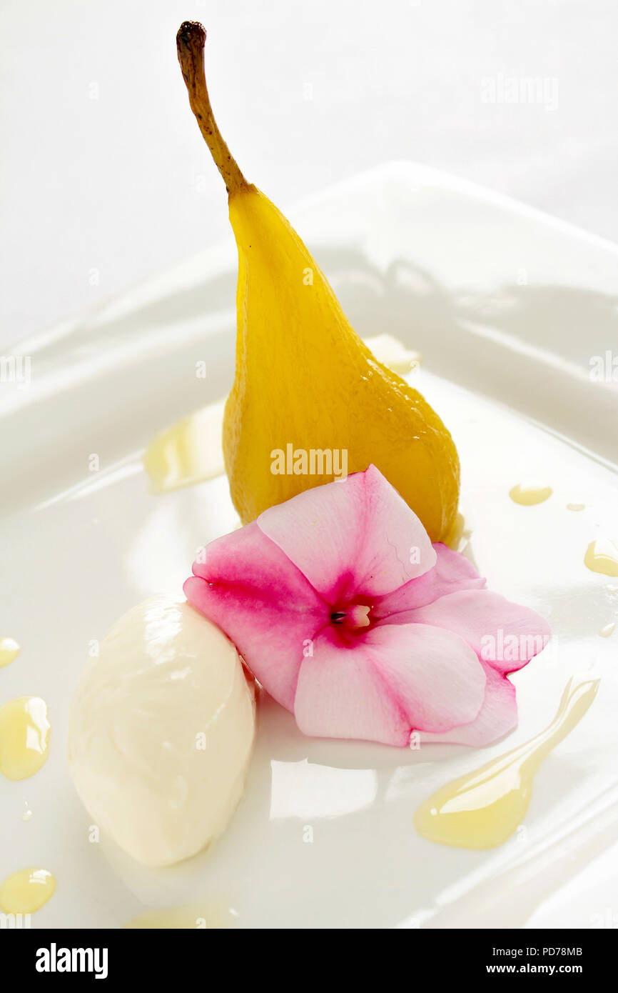 plated poached pear dessert Stock Photo - Alamy
