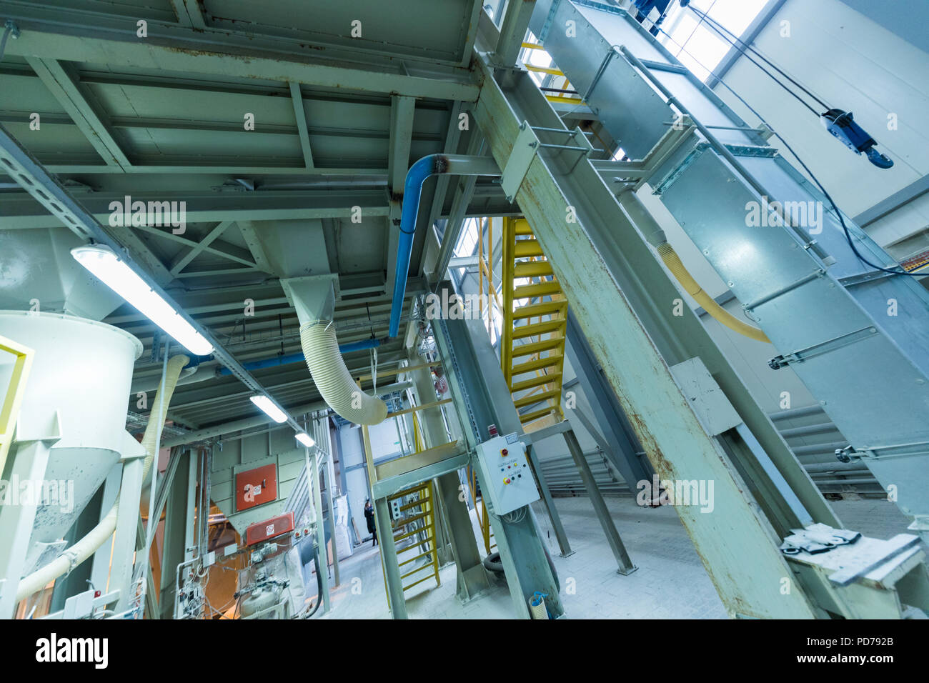 Fiberglass production industry equipment at manufacture background ...