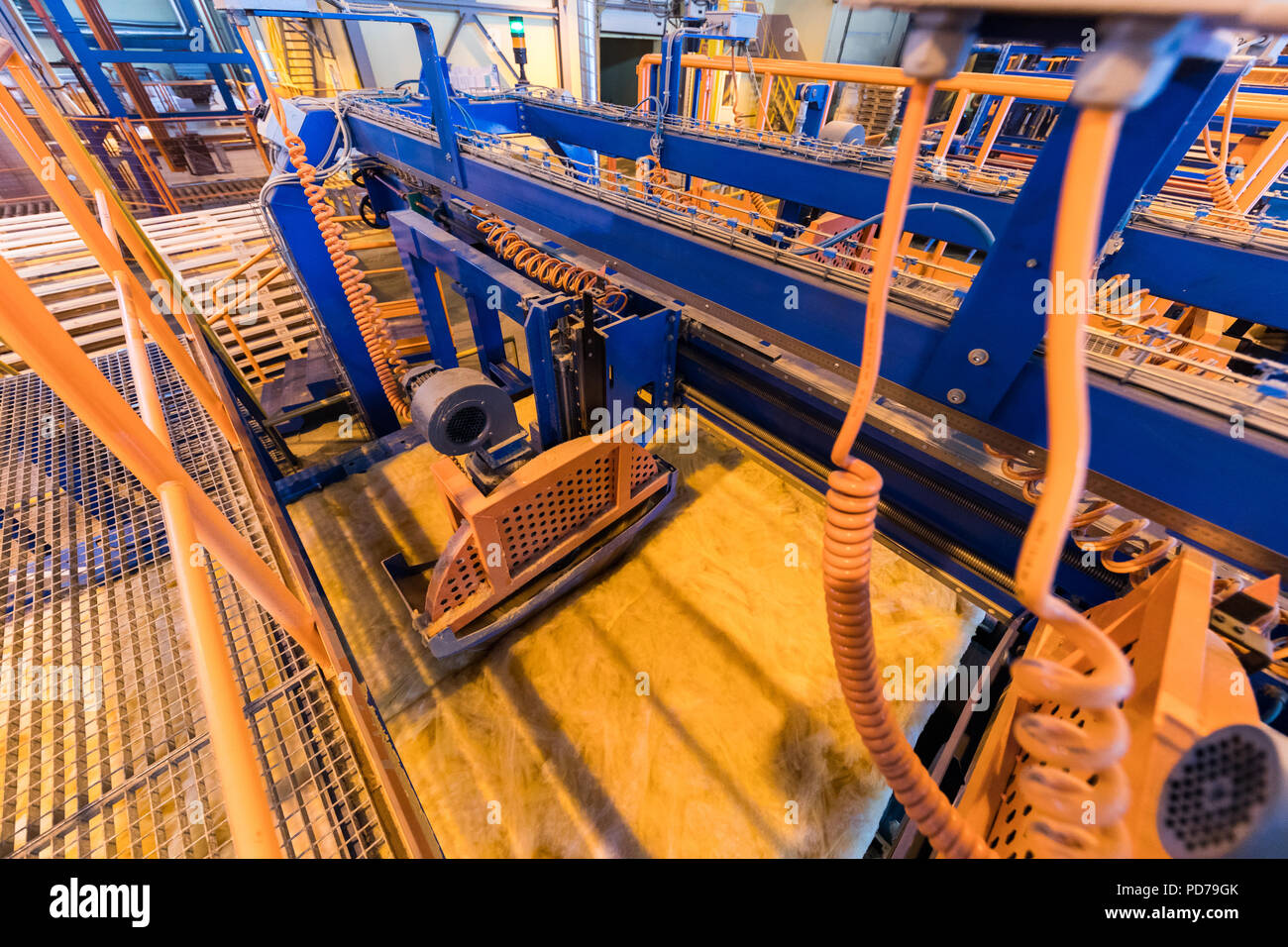 Fiberglass production industry equipment at manufacture background ...