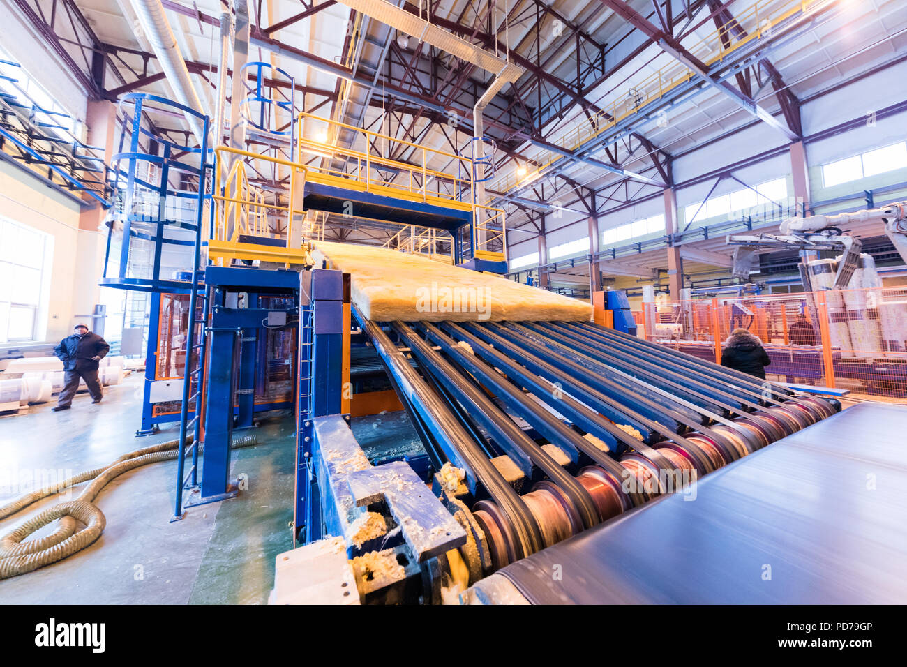 Fiberglass production industry equipment at manufacture background ...