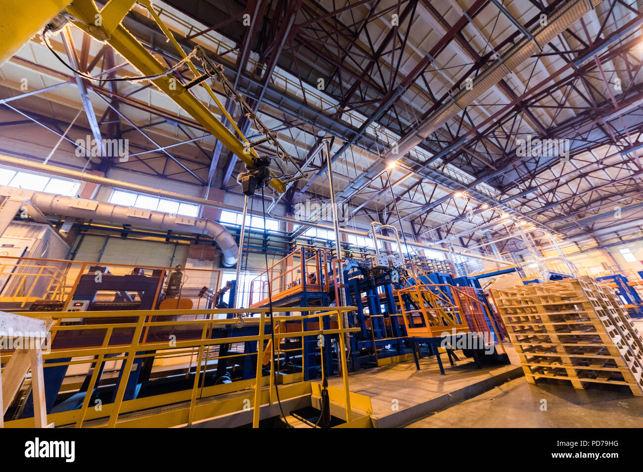 Fiberglass production industry equipment at manufacture background ...