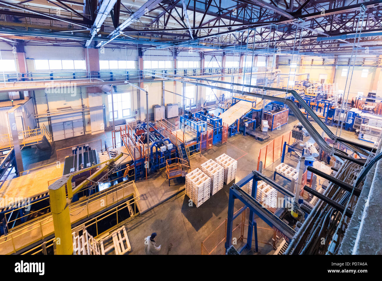 Fiberglass production industry equipment at manufacture background ...