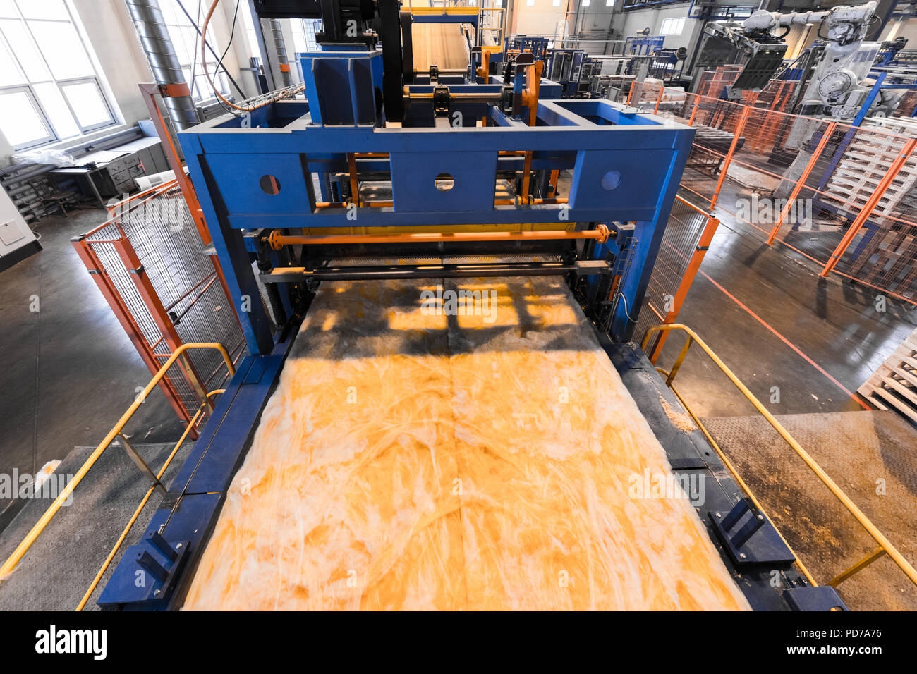 Fiberglass production industry equipment at manufacture background ...