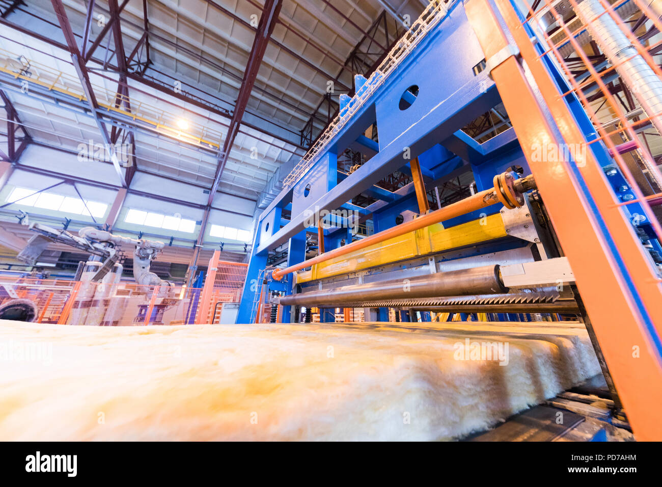 Fiberglass production industry equipment at manufacture background ...