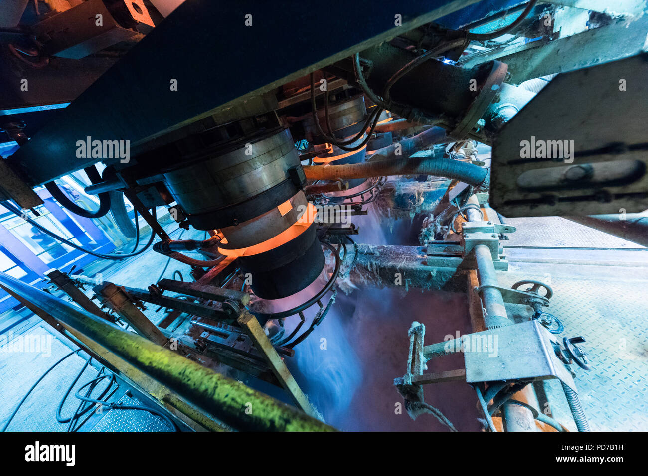 Fiberglass production industry equipment at manufacture background ...