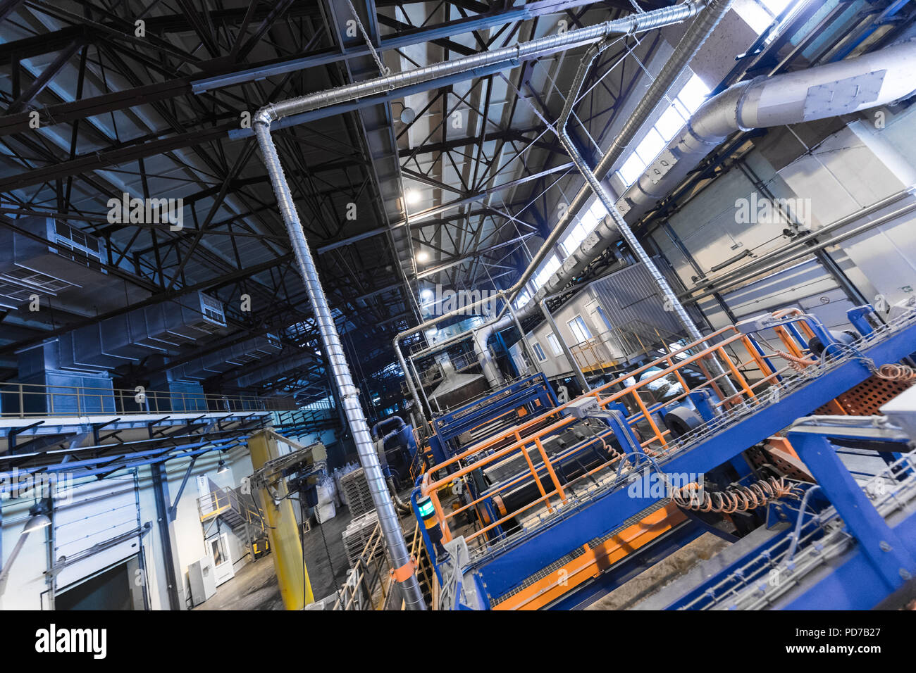 Fiberglass production industry equipment at manufacture background ...