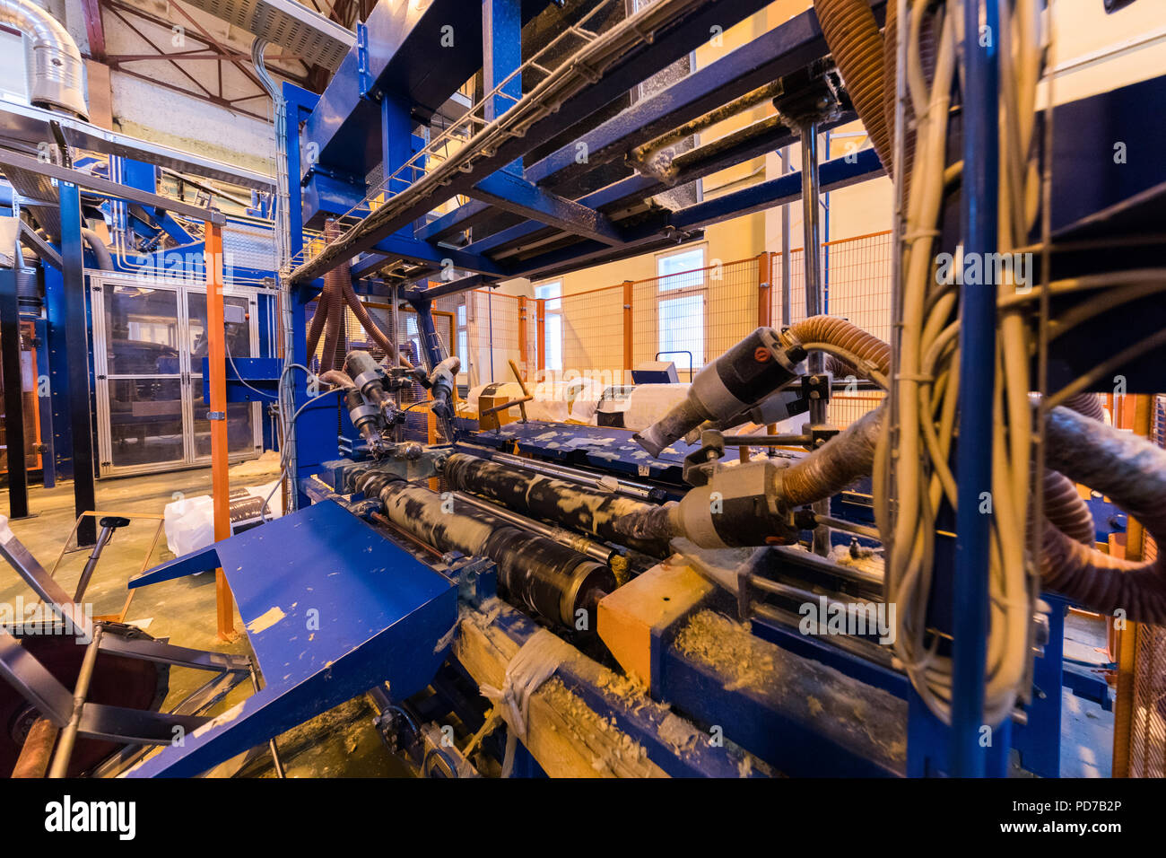 Fiberglass production industry equipment at manufacture background ...