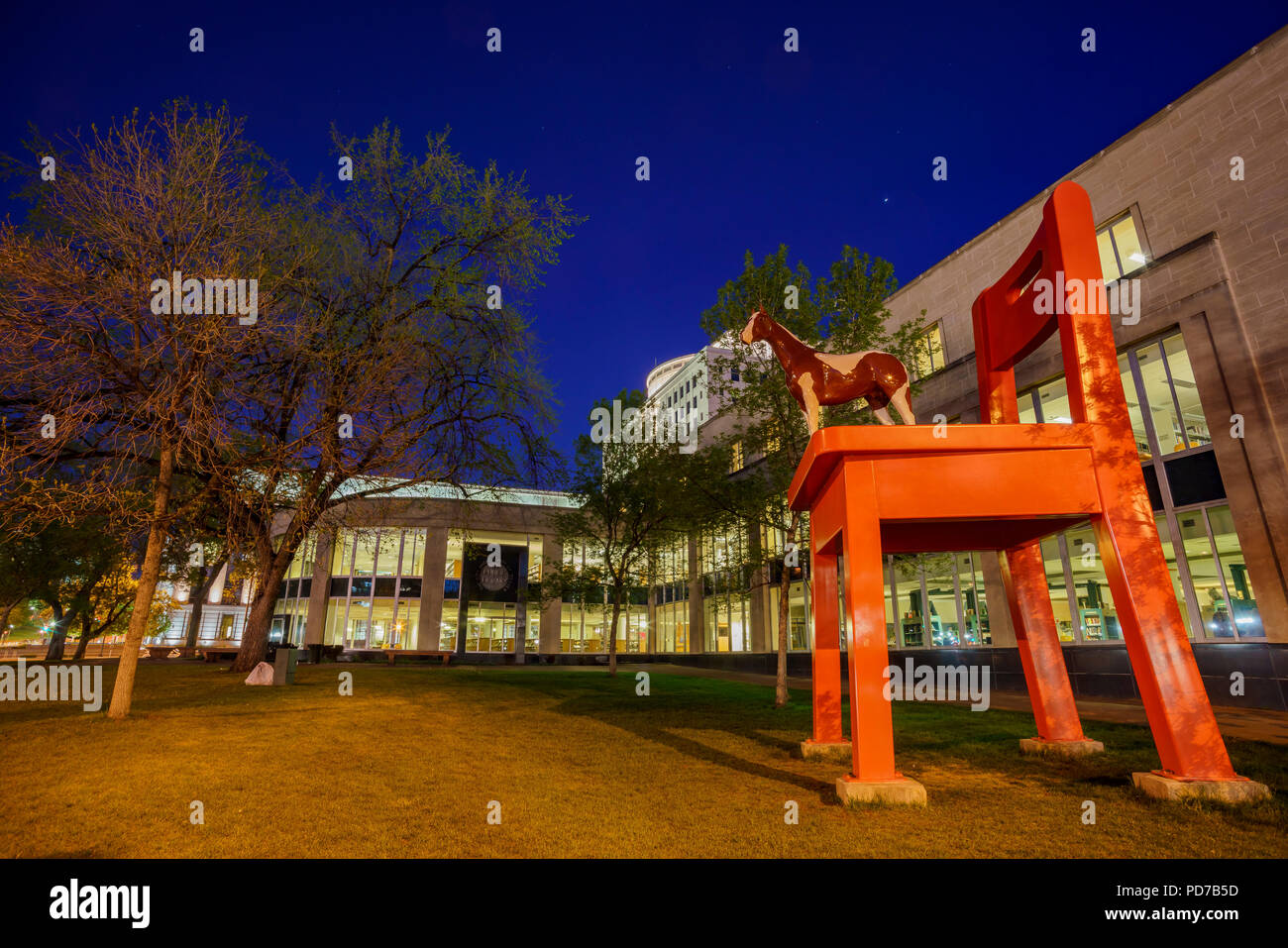Night view of the Big red chair and horse statue of the Denver Central ...